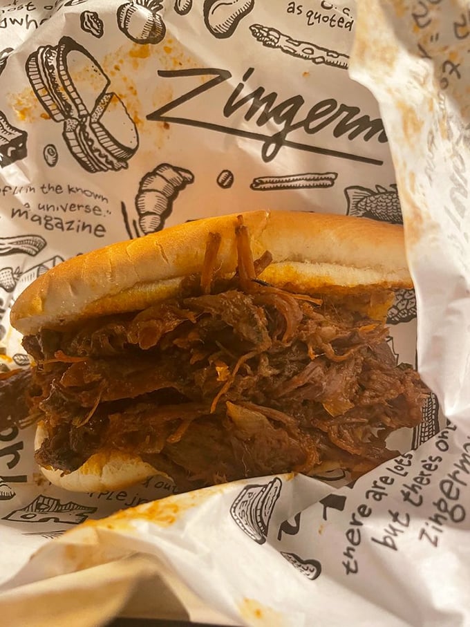 BBQ brisket nestled in a soft roll—where smoke meets sweet in a relationship your taste buds will want to third-wheel.