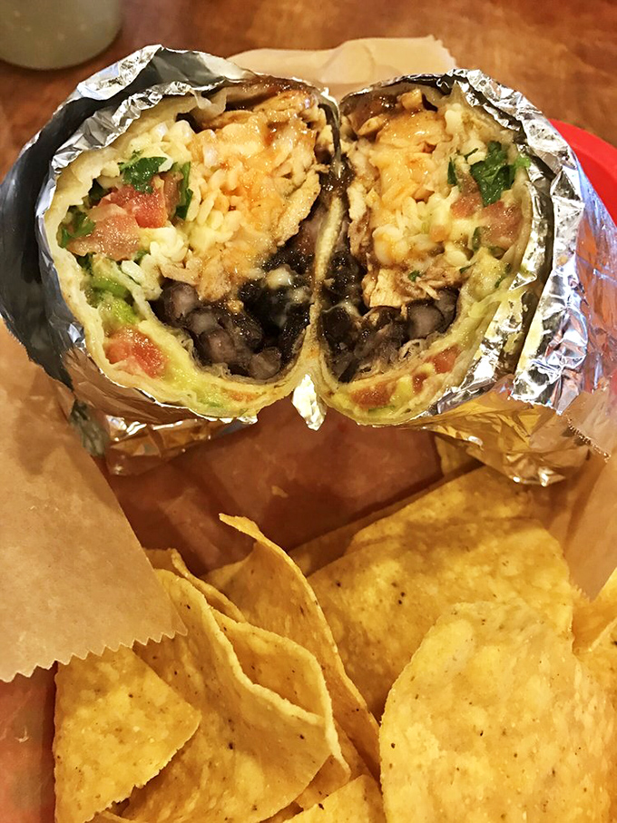 Cut in half to reveal its secrets, this burrito displays the perfect cross-section of ingredients—a delicious geology lesson worth studying up close.