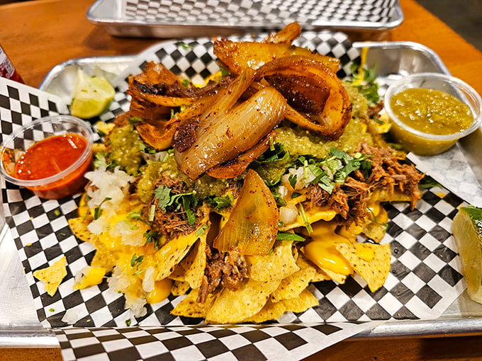 The perfect tray of nachos doesn't exi— Oh wait, here it is! That red soda alongside is the unsung hero of this flavor fiesta.