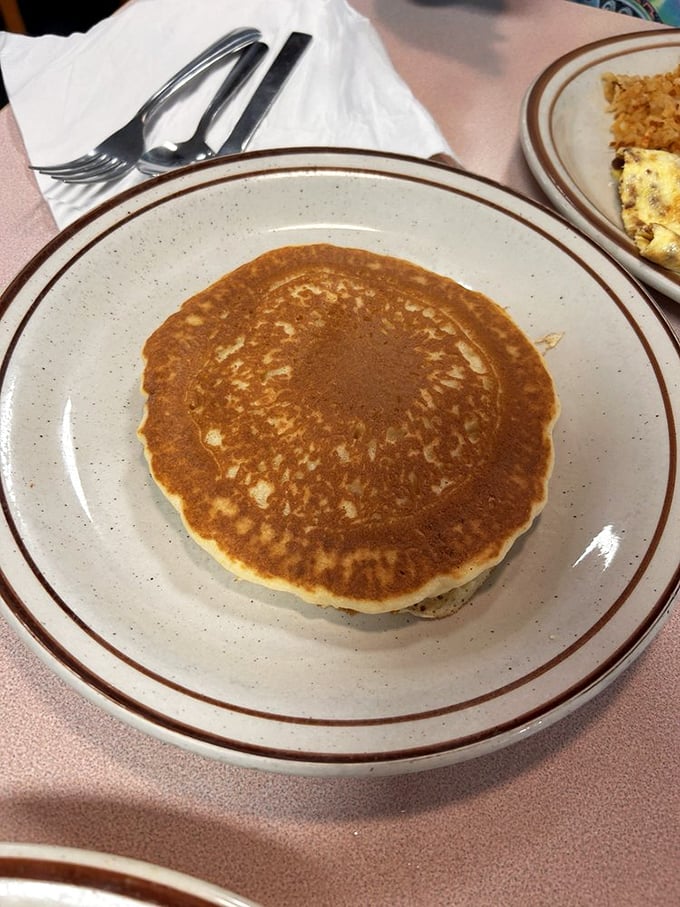 The perfect pancake doesn't need fancy toppings—just that ideal golden hue and airy interior that soaks up syrup like a dream.