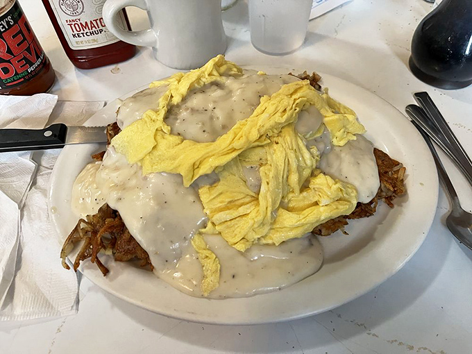 This isn't just breakfast—it's architecture. Layers of hash browns, eggs, and gravy creating the Taj Mahal of morning sustenance.