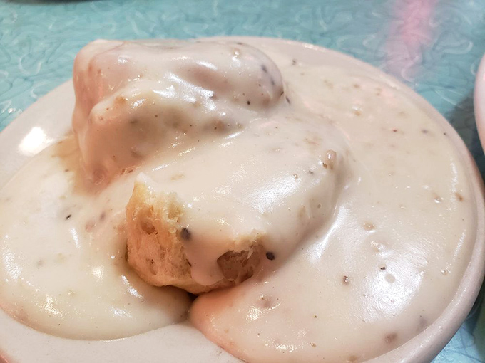Biscuits and gravy—the breakfast that hugs you from the inside. This creamy, peppery blanket of goodness turns ordinary biscuits into morning magic.