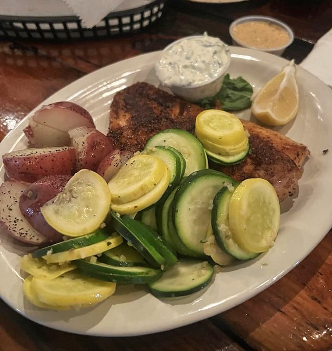 Blackened mahi that doesn't hide behind heavy sauces, accompanied by fresh vegetables and red potatoes that respect the fish's starring role.