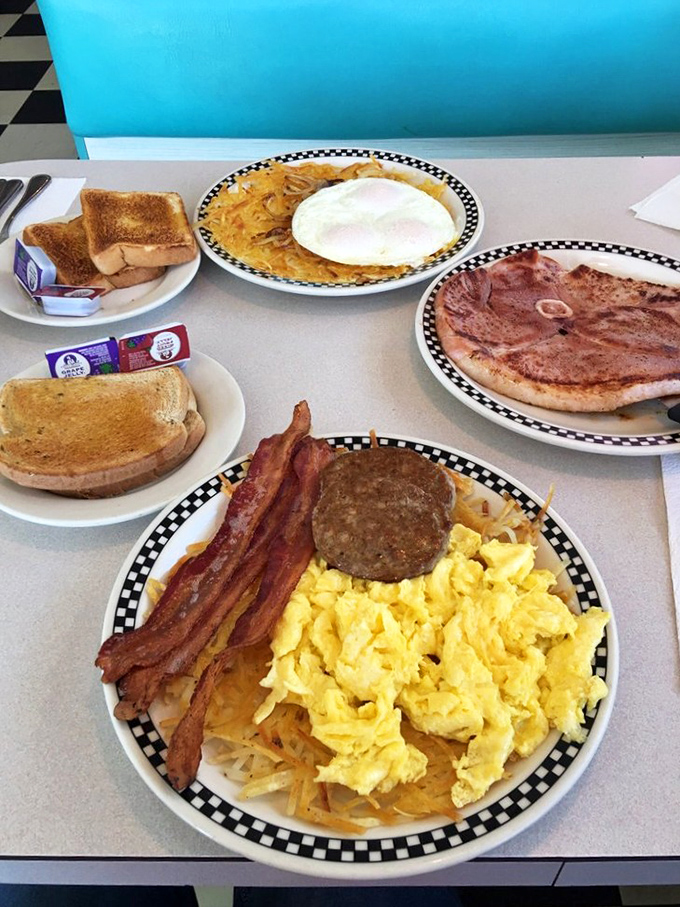 Breakfast nirvana – crispy hash browns, fluffy scrambled eggs, and bacon that makes you question why you'd ever skip the most important meal.