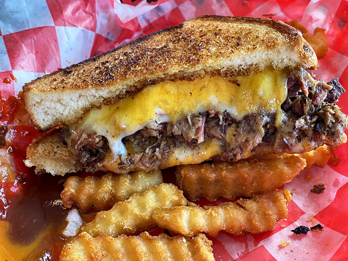 This brisket melt isn't just a sandwich—it's a life event. The cheese isn't melted; it's committed to a long-term relationship with that smoky meat.