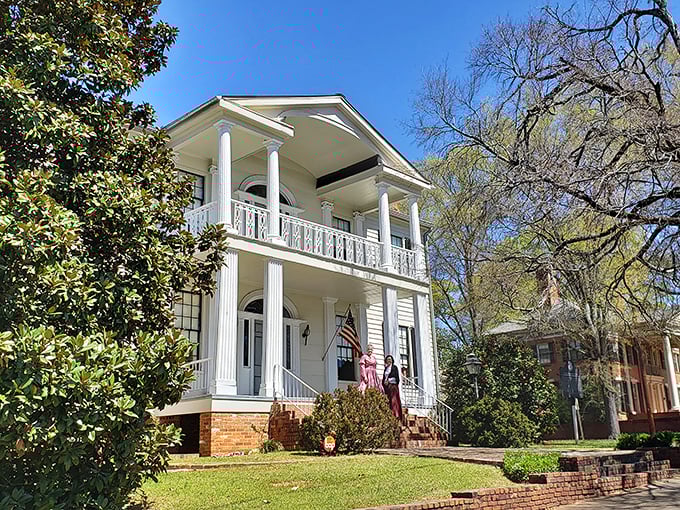 This magnificent yellow antebellum home, framed by wrought iron and history, makes modern McMansions look like they're trying way too hard.
