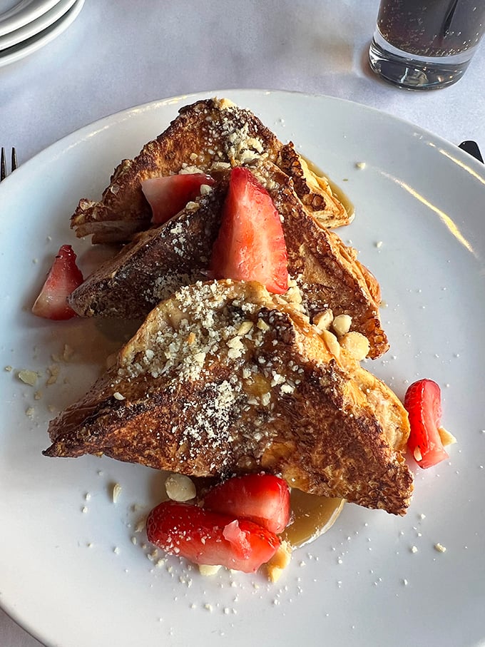This isn't just French toast—it's brioche transformed into a breakfast masterpiece, with strawberries playing the perfect supporting role.