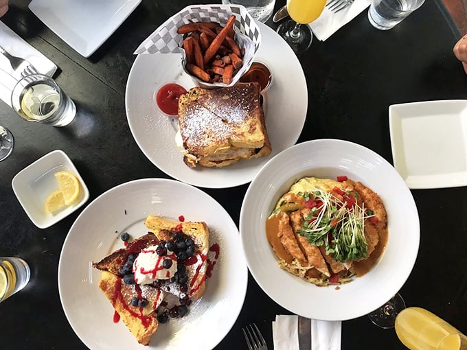 Brunch spread that would make your grandmother proud. Three distinct breakfast personalities sharing one table—like a delicious morning sitcom.