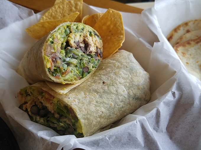 The burrito's faithful sidekick—house-made tortilla chips—stands ready to assist with any salsa overflow situations. A dynamic duo of deliciousness.