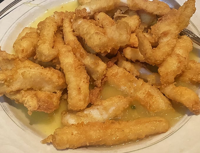 Crispy, golden perfection swimming in butter sauce—these calamari don't need gimmicks, just a squeeze of lemon and good company.