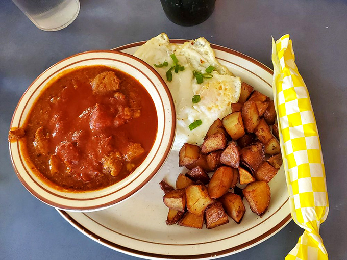 Red chile, potatoes, and what appears to be breakfast nirvana on a plate. The kind of meal that makes you consider relocating to New Mexico.