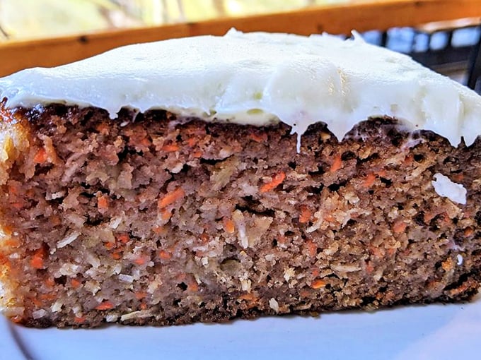 Carrot cake that actually tastes like it contains vegetables, in the best possible way. The cream cheese frosting is just the supporting actor in this bakery drama.