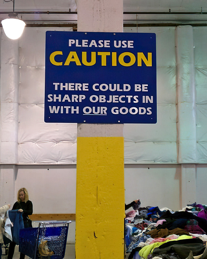 The blue bins create their own geography—valleys of value and mountains of merchandise waiting to be explored by intrepid shoppers.