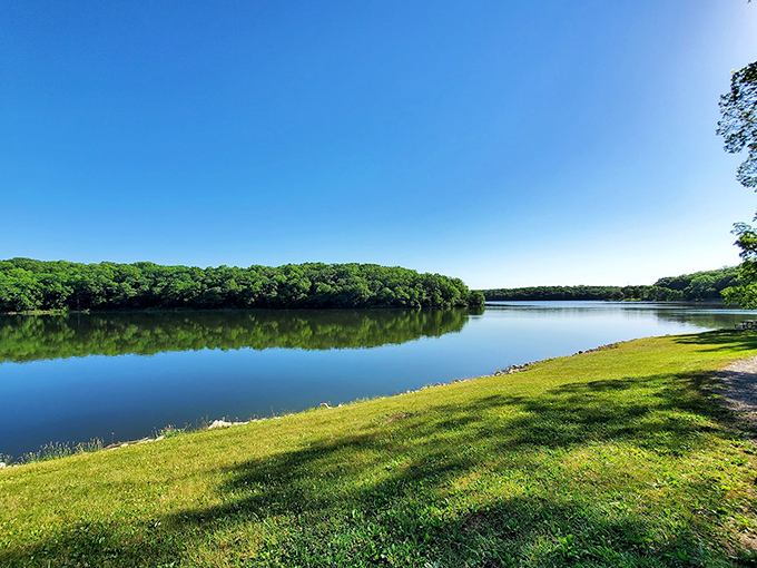 Cedar Lake mirrors the sky with such perfect stillness you might forget which way is up—nature's own meditation app.