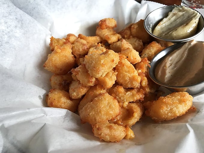 Cheese curds that would make a Frenchman weep. These golden nuggets aren't just fried cheese – they're little pieces of Wisconsin's soul.