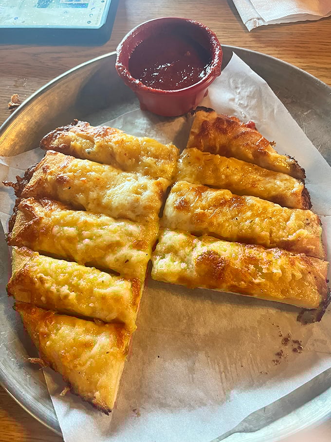 Behold the cheese pizza in its natural habitat – golden crust, bubbling cheese, and not a single unnecessary frill. Sometimes simplicity is the ultimate sophistication.
