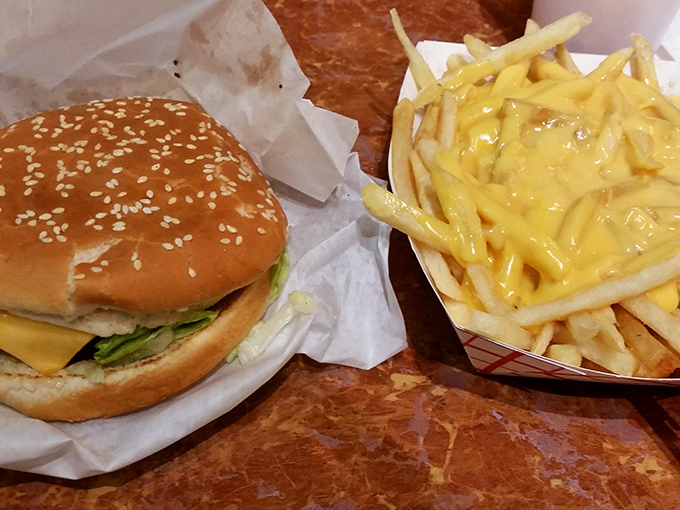 This isn't just a cheeseburger—it's what happens when simple ingredients receive the respect they deserve, with cheese fries that defy gravity.