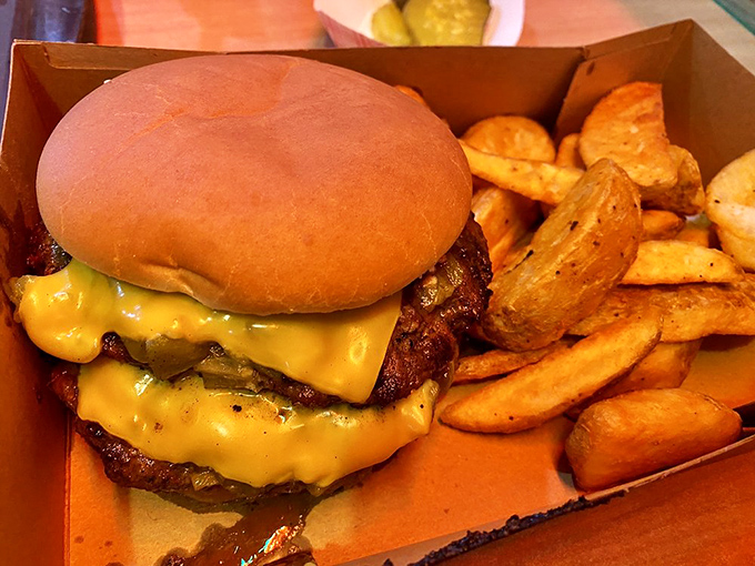 A cheeseburger that demands to be photographed before eating, though your stomach will protest the delay. Those fries aren't playing supporting role—they're co-stars.