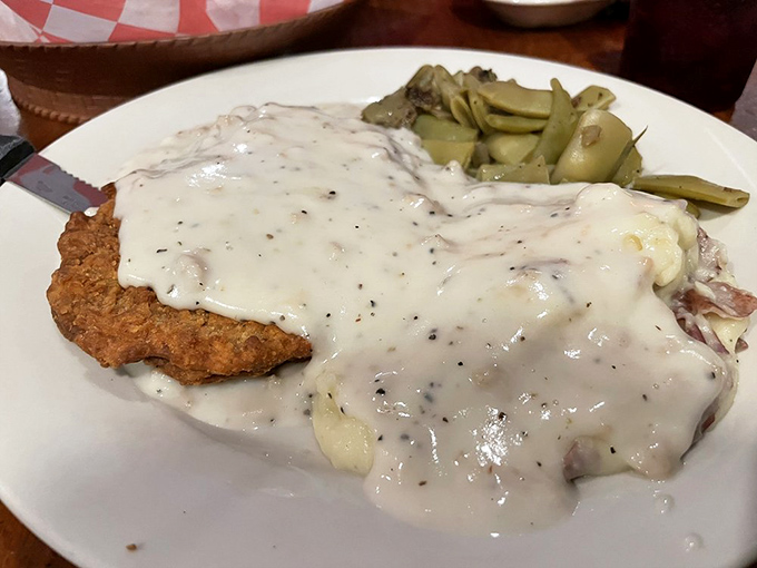 The legendary chicken fried steak—crispy exterior giving way to tender meat underneath, all swimming in gravy that deserves its own Instagram account.
