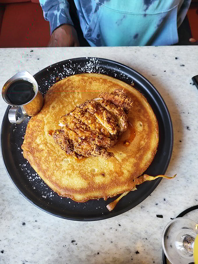 This isn't just breakfast, it's morning theater—golden-crisp chicken alongside a pancake so perfect it deserves its own standing ovation.