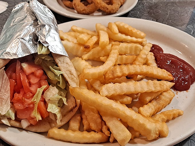 When a gyro and fries share a plate, it's not just lunch—it's a Mediterranean vacation without the passport or uncomfortable middle seat.