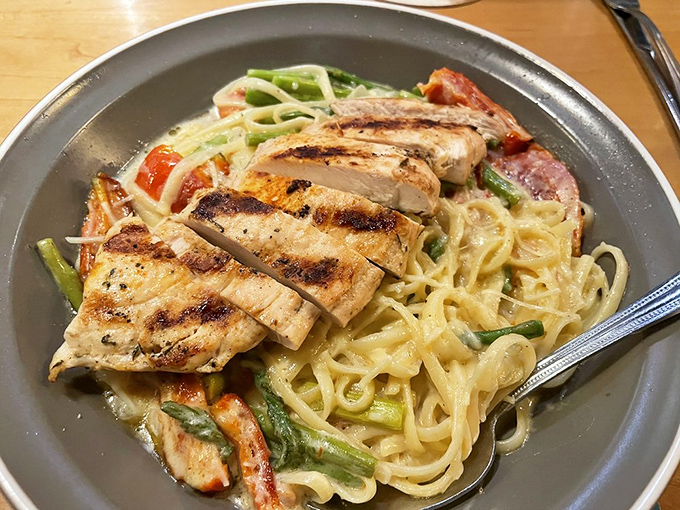 Not just a beer joint—this pasta proves Squatters has range. Grilled chicken atop creamy fettuccine with fresh vegetables shows their culinary chops.