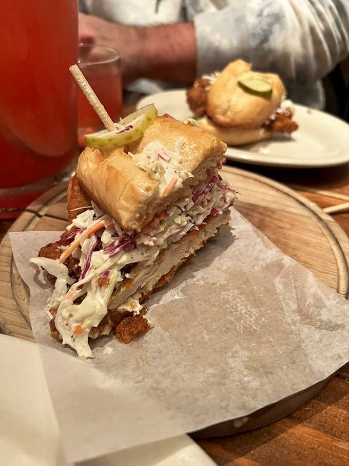 This chicken sandwich isn't just stacked—it's architected. The slaw provides structural integrity while delivering a perfect crunch-to-cream ratio.