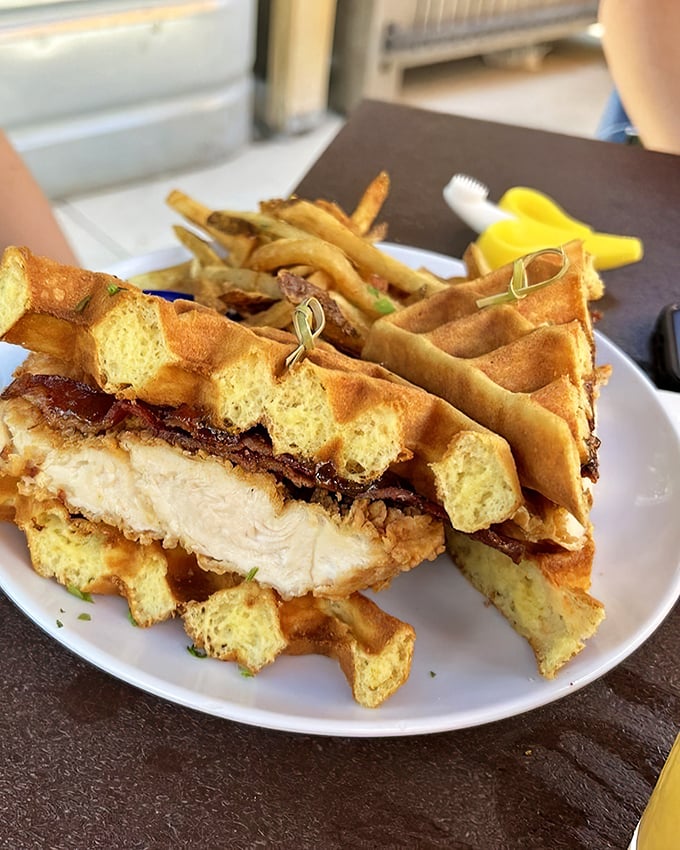 The chicken and waffle sandwich – where breakfast and lunch stopped fighting and fell madly in love on your plate.