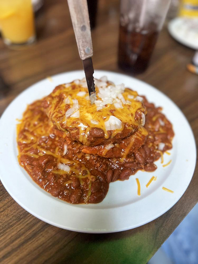 This isn't just chili—it's a masterclass in comfort. Topped with melted cheese and onions, it's the kind of dish that makes winter bearable.
