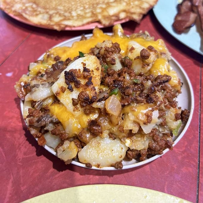This isn't just hash – it's a savory symphony of potatoes, chorizo, and melted cheese that makes you question why you'd ever eat anything else for breakfast.