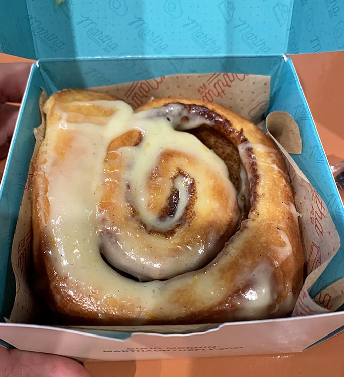 A cinnamon roll that's achieved pastry perfection—spiral design by Leonardo, glaze by the breakfast gods. Worth setting your alarm for.