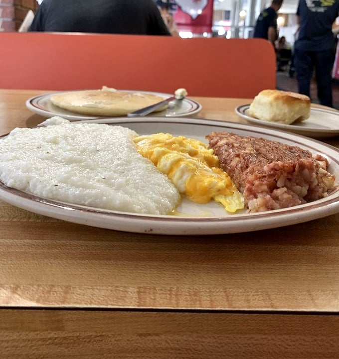 This isn't just breakfast—it's a plate of possibilities. Eggs, grits, and biscuits: the holy trinity of morning sustenance in South Carolina.