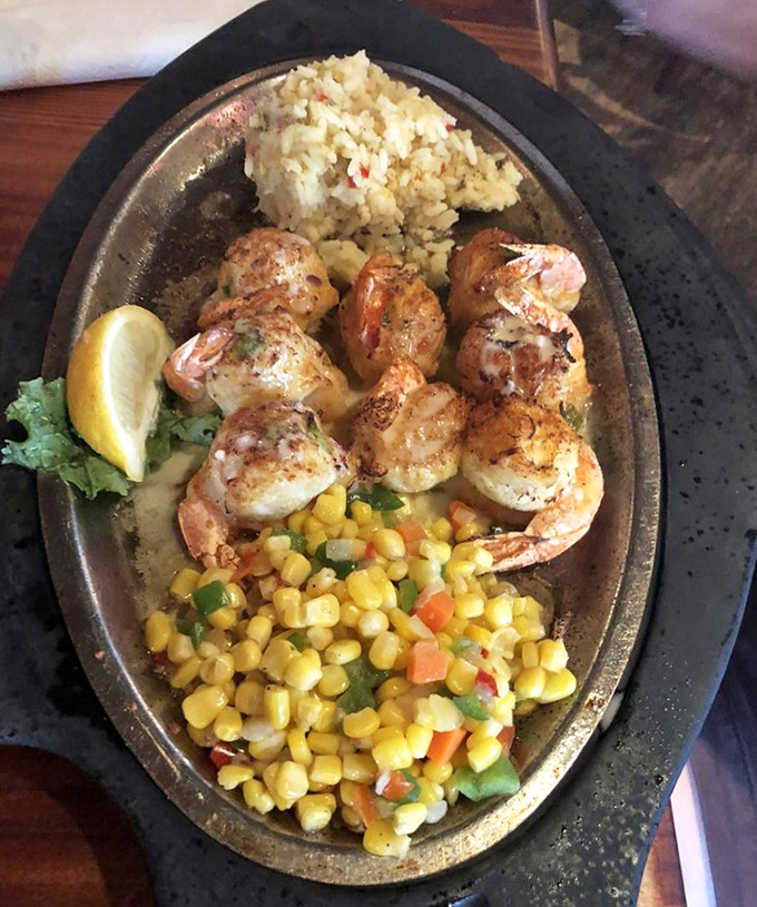 These crab-stuffed shrimp are like the seafood equivalent of Russian nesting dolls—delicious surprises within delicious surprises, all on a sizzling platter.