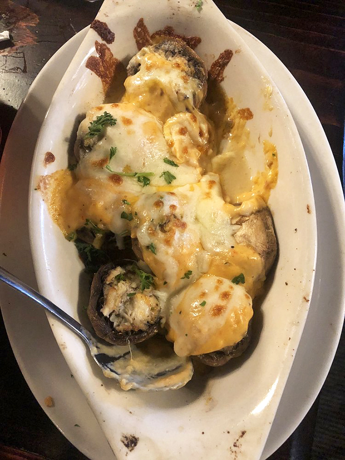 These stuffed mushrooms topped with melted cheese look like little flavor bombs ready to detonate your taste buds. I'd happily fall on this grenade. 