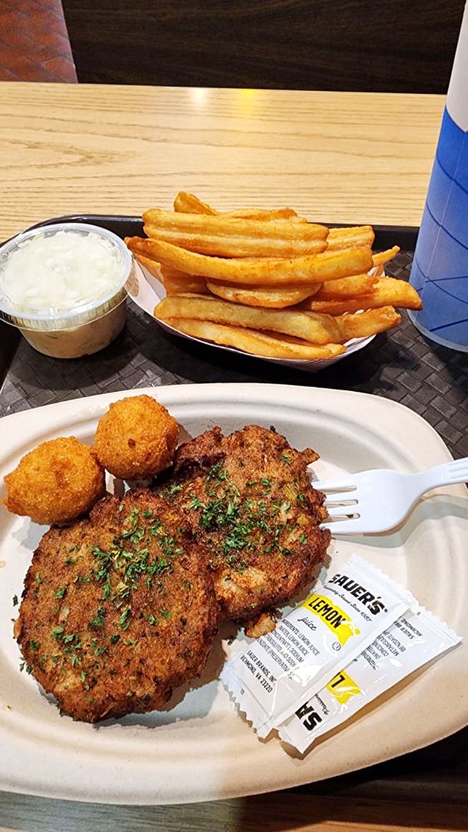 Crab cakes and fries with a side of hushpuppies – the holy trinity of comfort food that makes Midwesterners forget they're nowhere near an ocean.