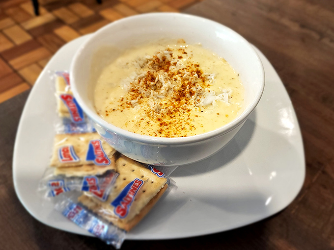 Cream of crab soup that looks like liquid gold in a bowl. Those oyster crackers aren't just garnish—they're essential texture companions for this velvety delight.