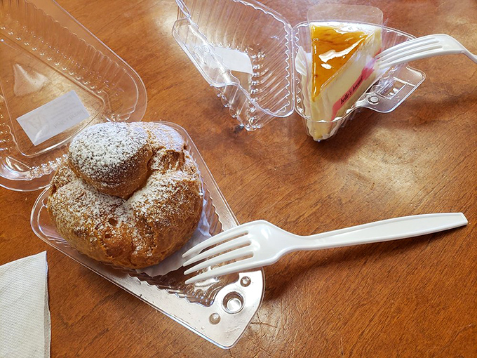 Takeout never looked so tempting. That cream puff is the pastry equivalent of finding an extra $20 in your winter coat—unexpected joy in plastic packaging.
