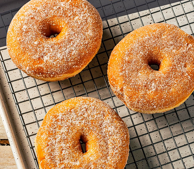 Sugar-dusted donuts that would make Homer Simpson weep with joy – perfectly golden circles of happiness that prove sometimes the simplest pleasures are the most profound.