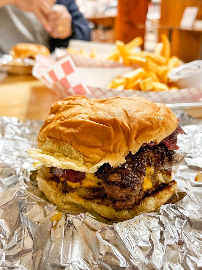 This isn't just a burger; it's a skyscraper of flavor with pastrami playing the starring role. 