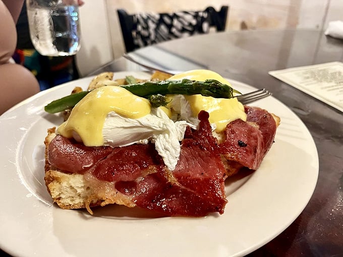 Eggs Benedict with ham that doesn't just bring home the bacon—it transforms it into something worth setting your alarm for on a Saturday.