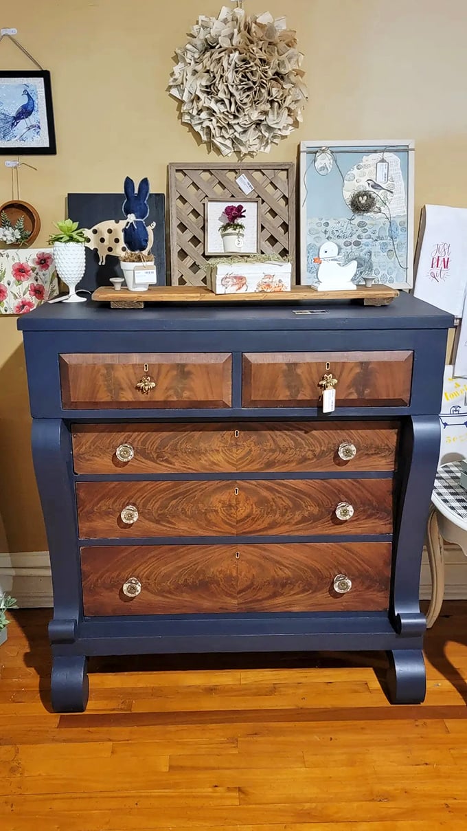 This navy and walnut Empire dresser doesn't just store clothes—it makes a statement that IKEA could only dream of achieving.