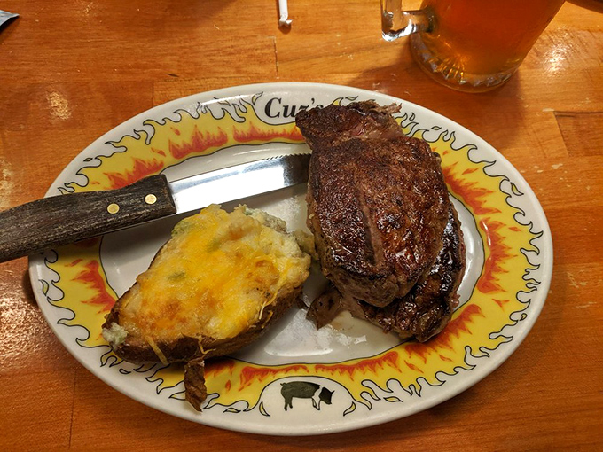 This filet mignon with loaded baked potato isn't just dinner – it's the reason people drive three hours through mountain roads without complaint.
