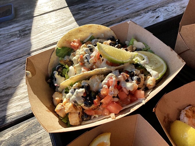 Not just tacos—they're seafood celebrations wrapped in tortillas. Black beans, fresh shrimp, and that lime wedge standing by for its moment of glory. 