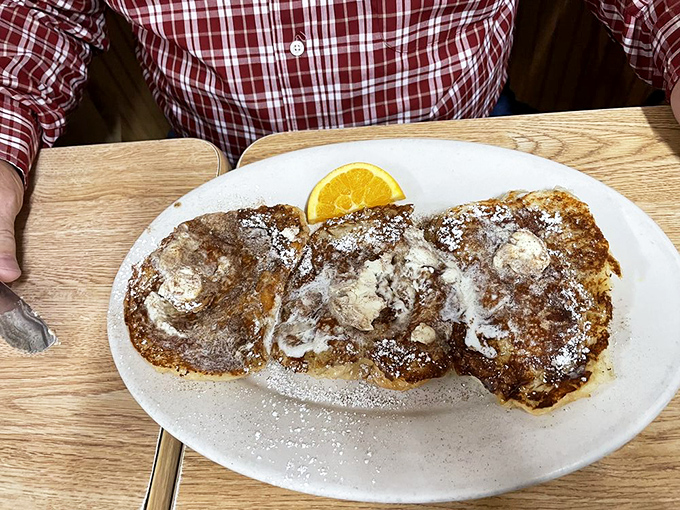 These pancakes aren't just breakfast, they're an event—golden, fluffy discs of joy topped with a dollop of butter melting into breakfast bliss.