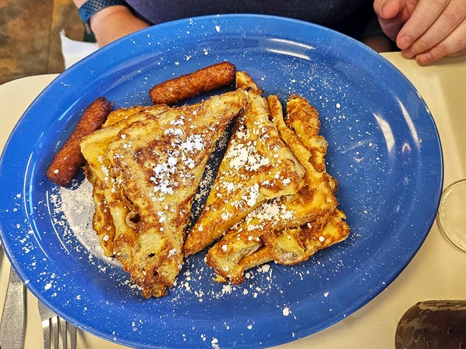 French toast that's had a proper education—golden, crispy edges with a custardy center that makes maple syrup feel privileged to be invited.