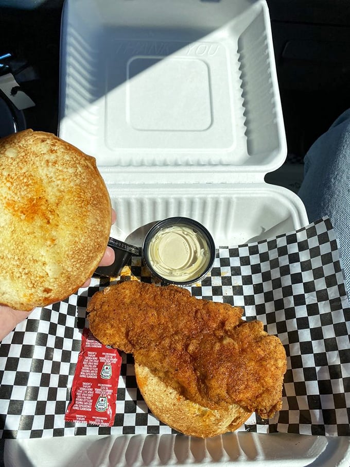 The ultimate road trip companion – a fried chicken sandwich that's worth pulling over for, complete with pickle slices for that perfect tang.
