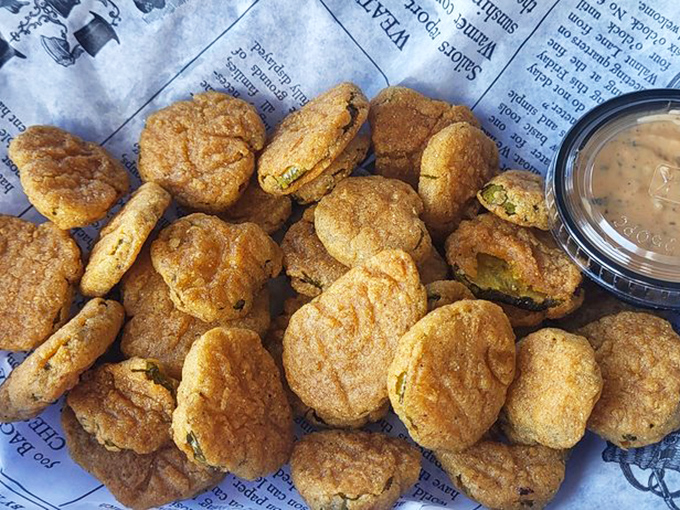 These fried pickles aren't just appetizers – they're little flavor bombs waiting to detonate with a perfect balance of tangy and crispy.