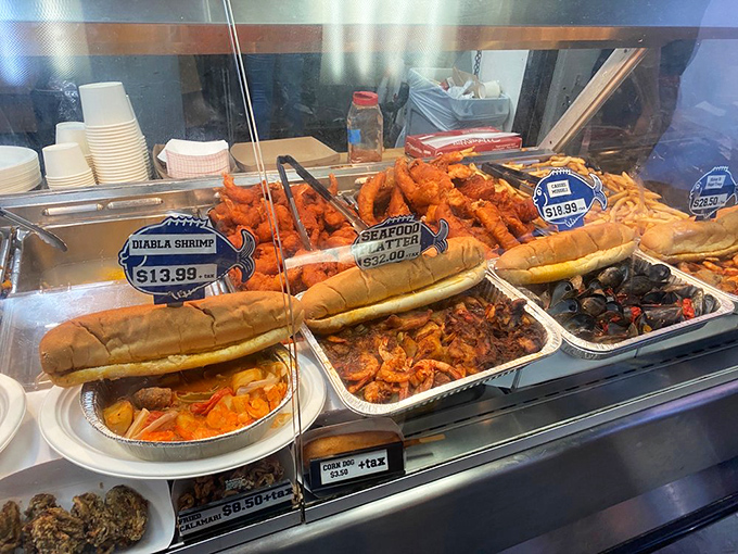 The seafood display case—where indecision becomes your only problem. Those seafood rolls are longer than some Hollywood relationships.
