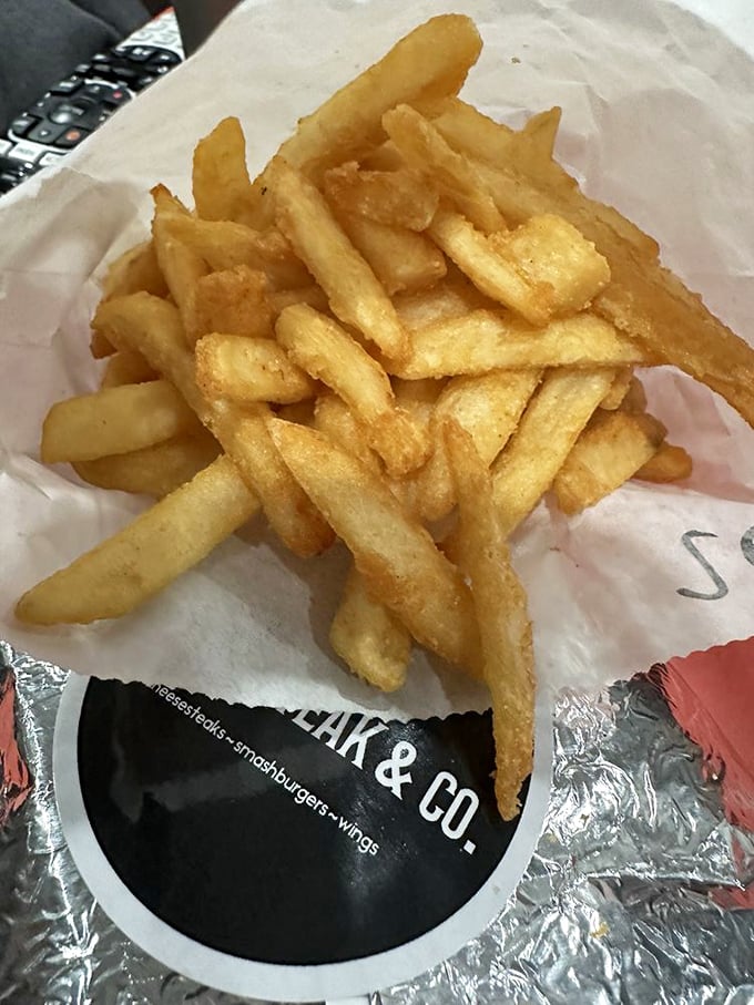 Golden, crispy fries that have achieved that perfect balance – substantial enough to dip yet delicate enough to practically disappear on your tongue.