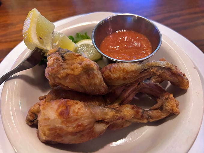 Frog legs that would make Kermit nervous—crispy, tender, and proof that sometimes the most unexpected menu items deliver the most delightful surprises.